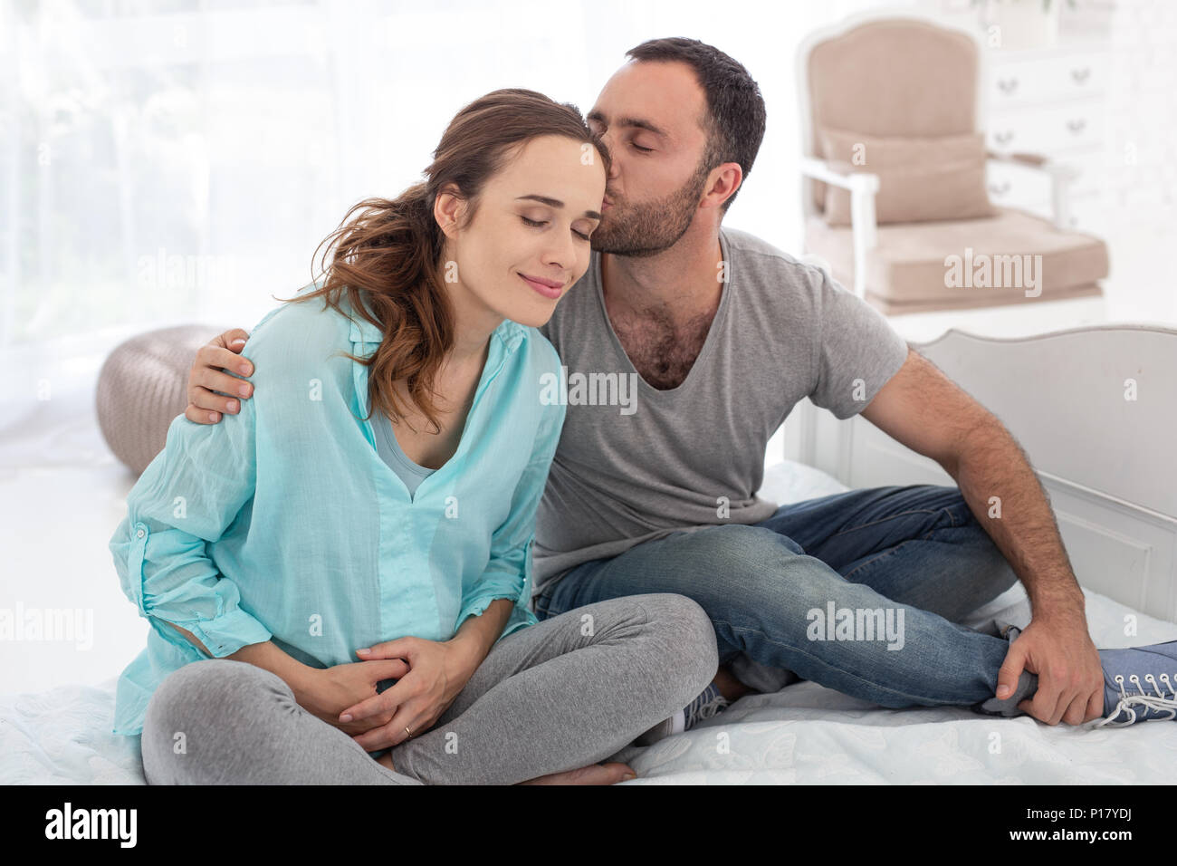 Handsome man loving pregnant woman Stock Photo - Alamy