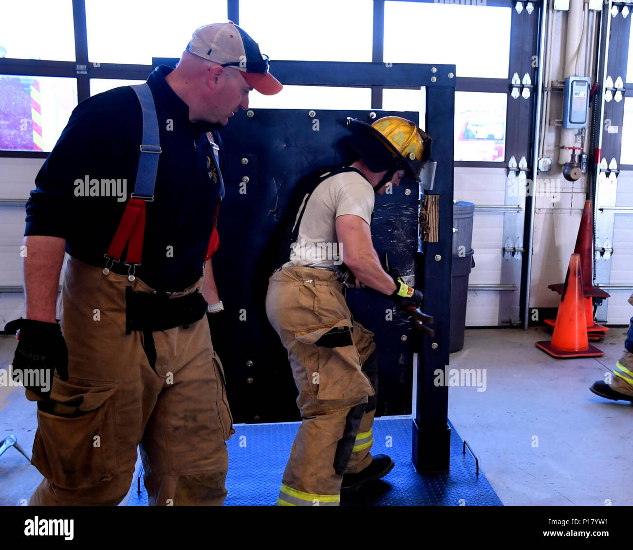 Airman with the civil engineer fire Department receive instruction from ...