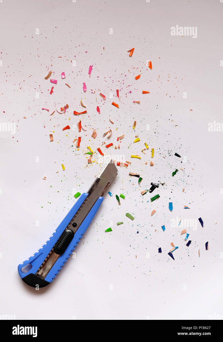 Flat lay of cutter knife with scattered colorful pencil shavings Stock ...