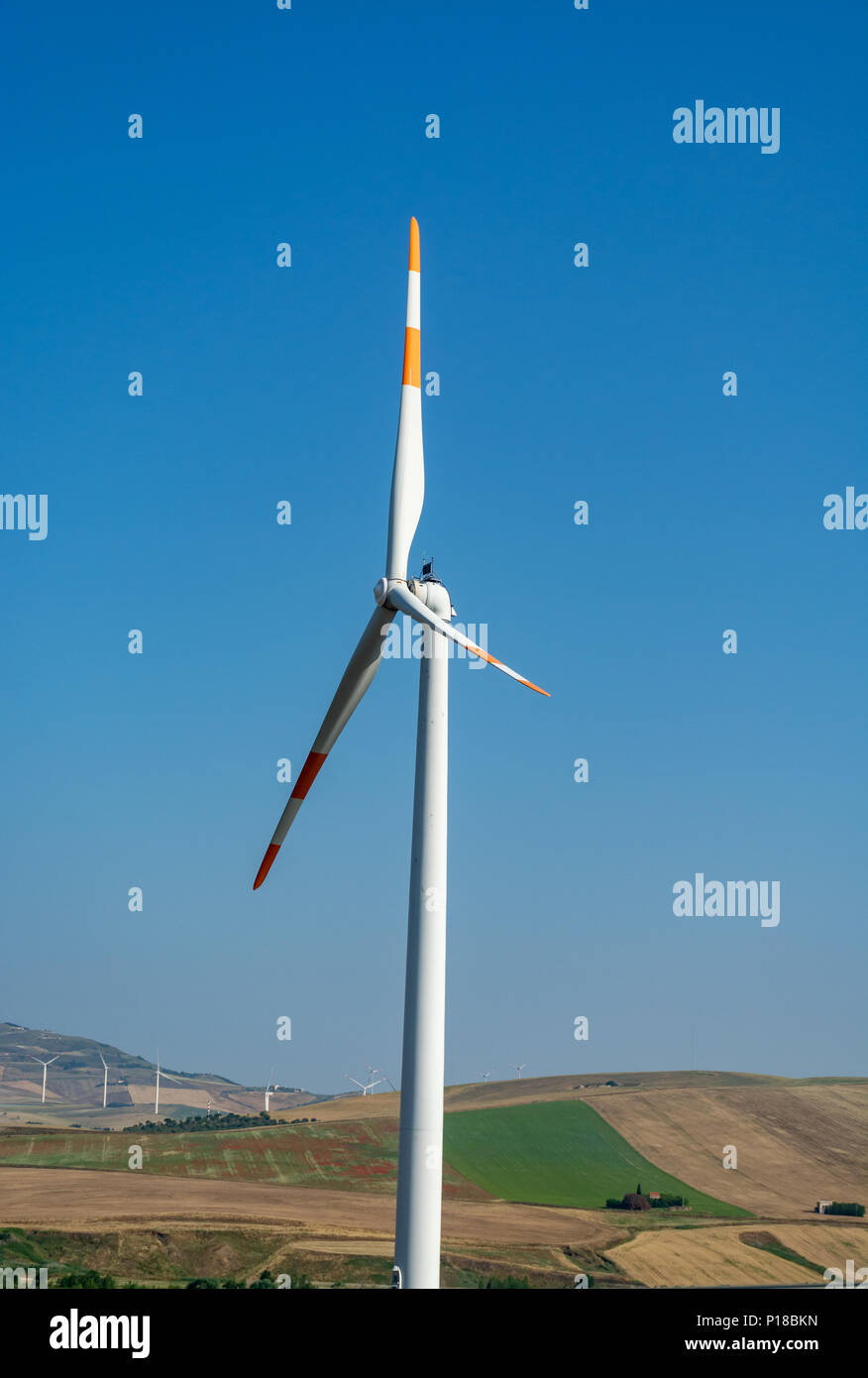 Modern wind farm with big wind turbines towers, source for renewable ...