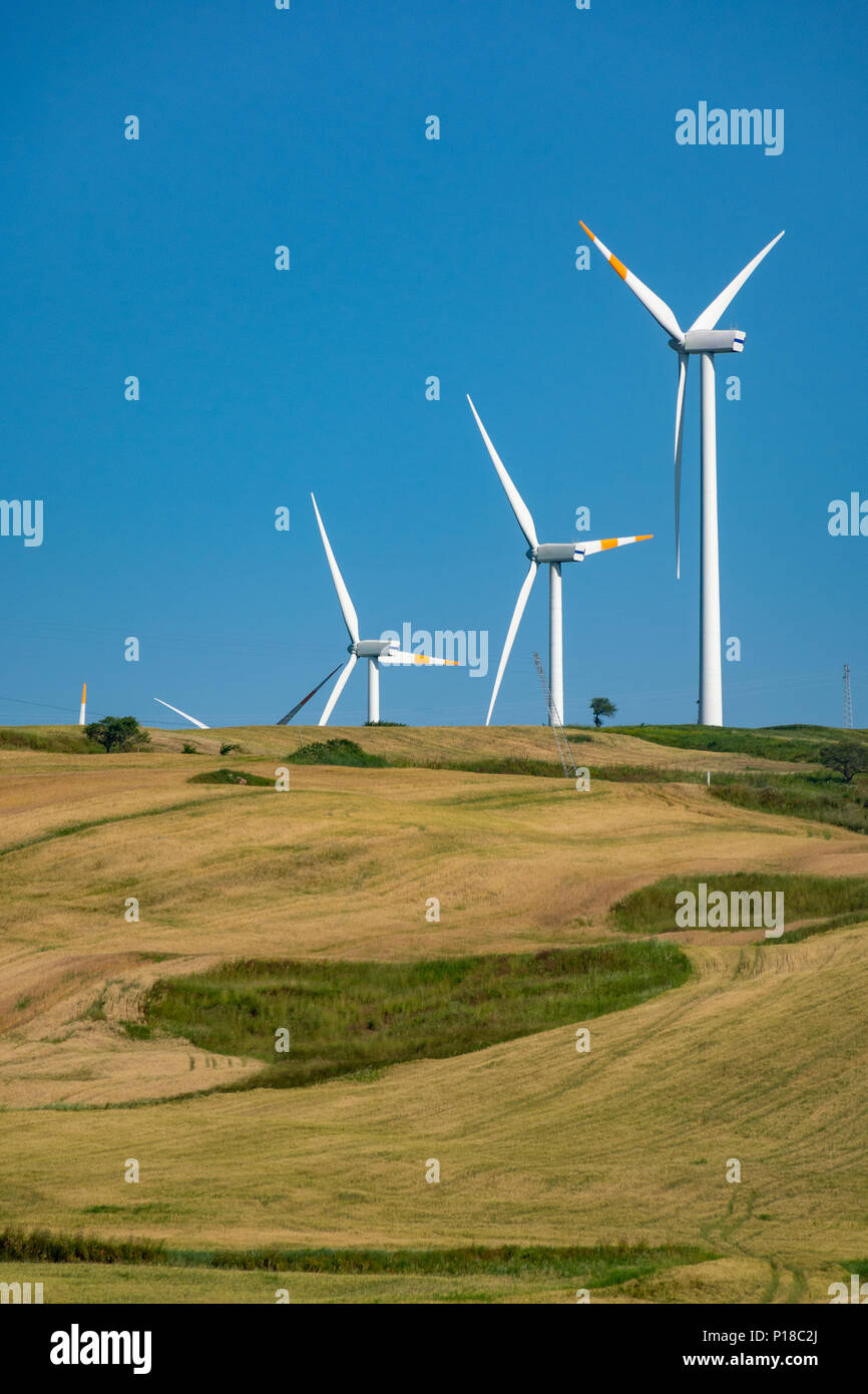 Modern wind farm with big wind turbines towers, source for renewable ...