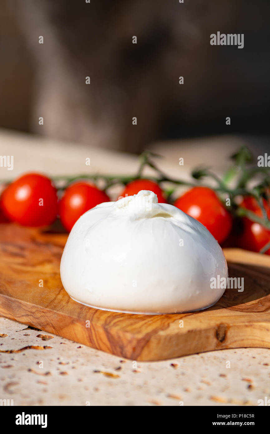 Fresh soft white burrata, buttery cheese, made from a mix of mozzarella ...
