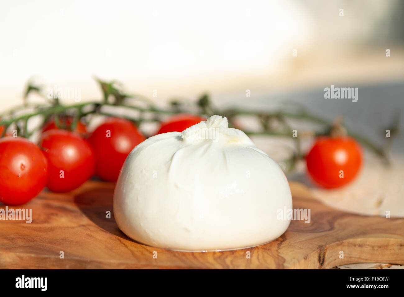 Fresh soft white burrata, buttery cheese, made from a mix of mozzarella ...