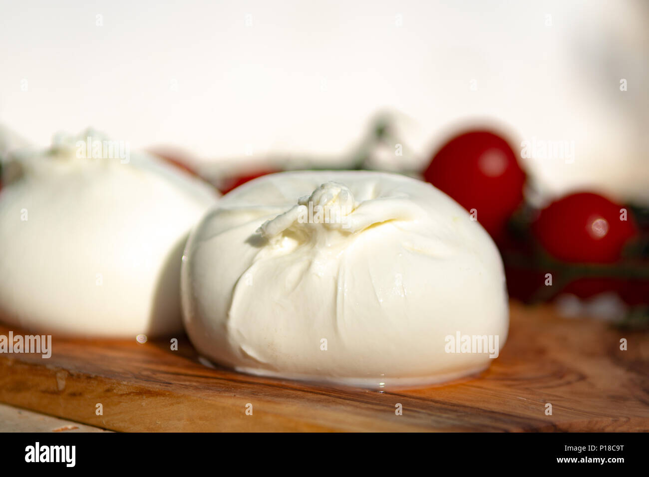 Fresh soft white burrata, buttery cheese, made from a mix of mozzarella ...