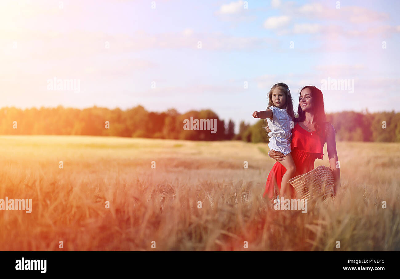 Young girl in a wheat field. Summer landscape and a girl on a nature ...