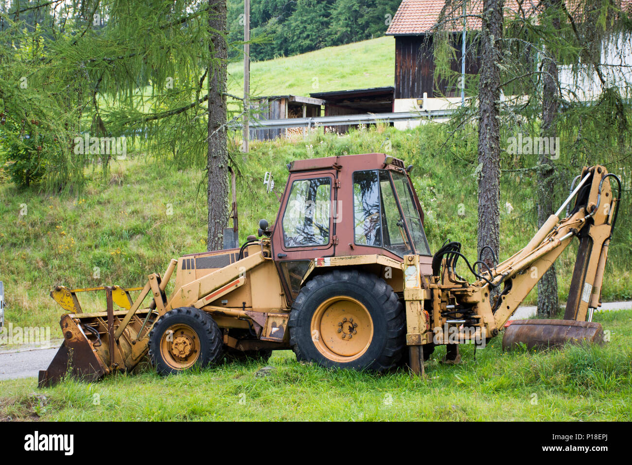 Excavator loader or backhoe machinery during earthmoving works outdoors ...