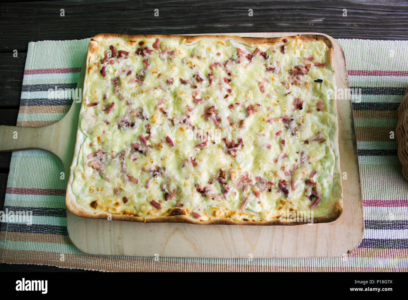 Square pizza thin crust on wooden plate serve for eat at restaurant in ...