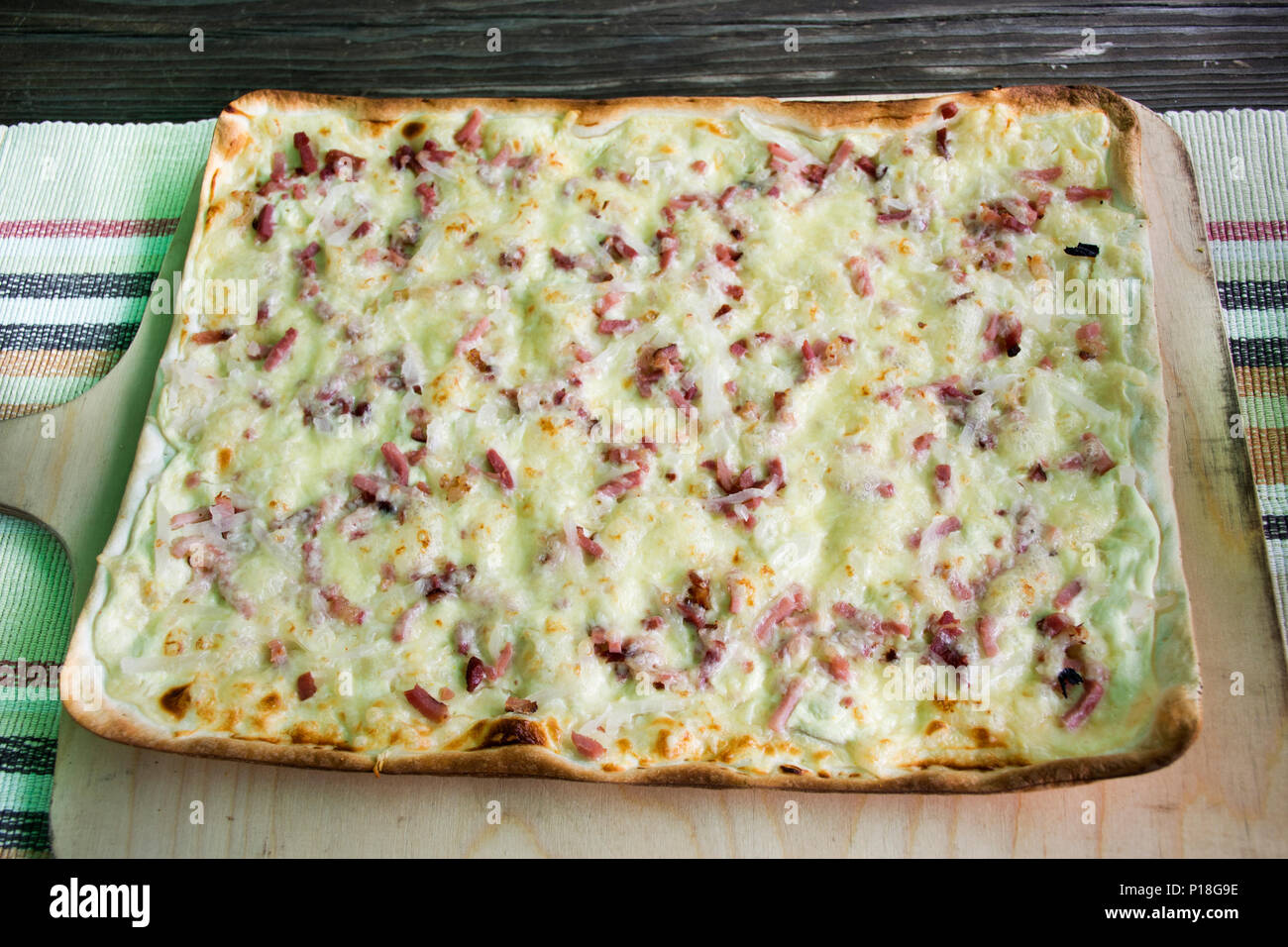 Square pizza thin crust on wooden plate serve for eat at restaurant in ...