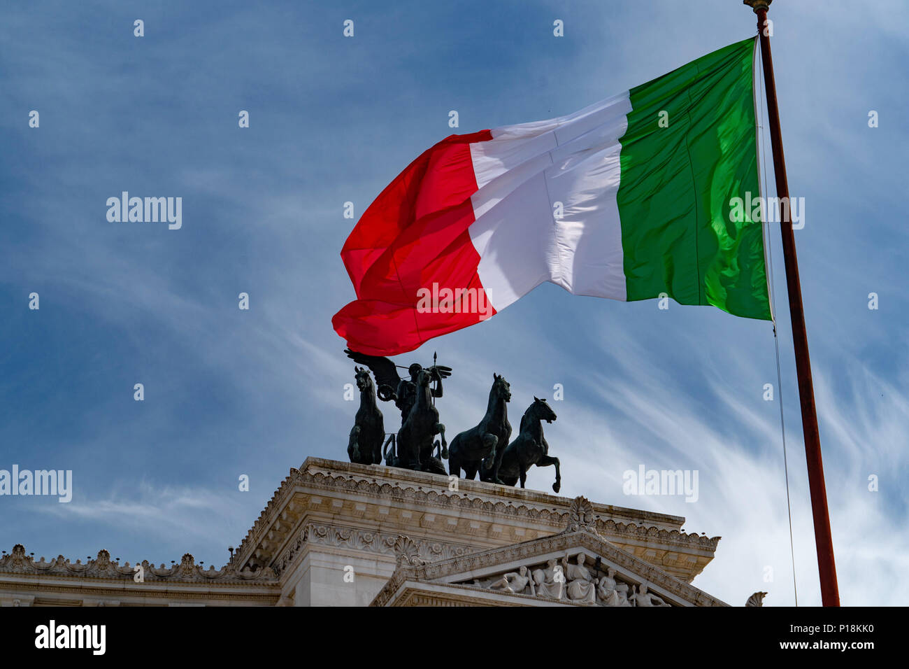 Italian three colors flag of Italy on the blue sky background Stock ...