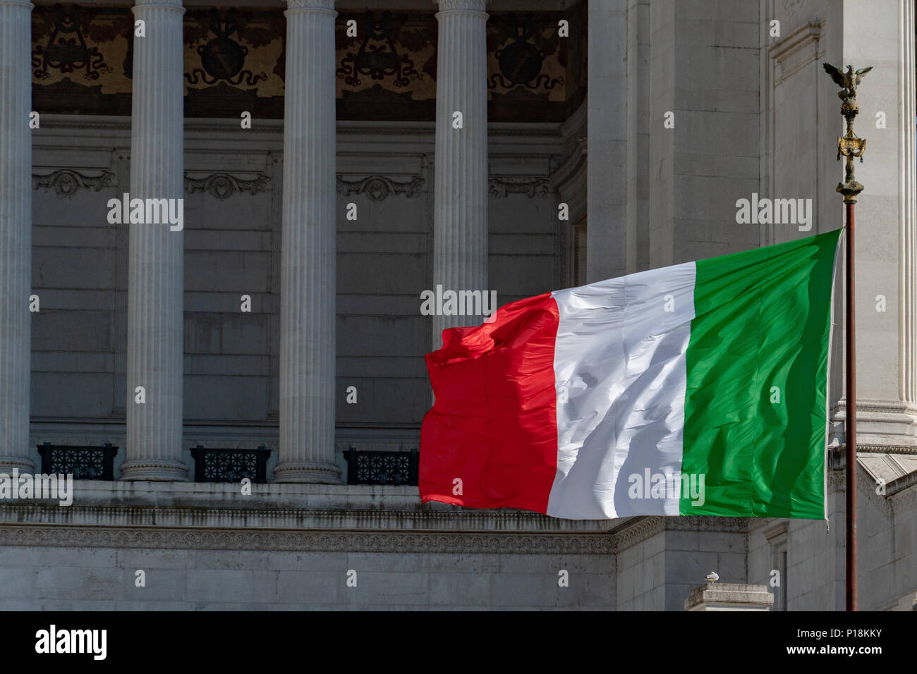 Italian three colors flag of Italy on the blue sky background Stock ...