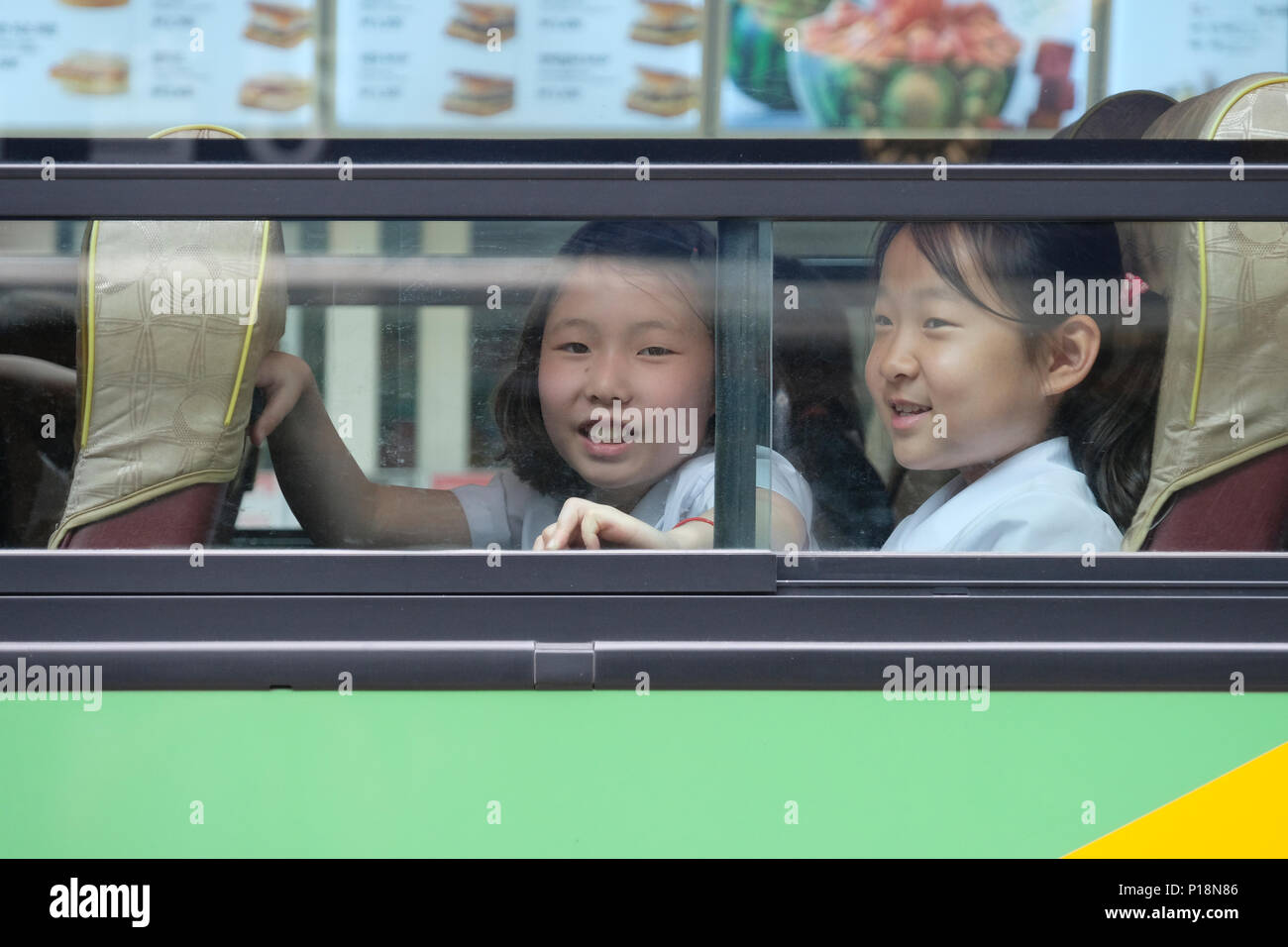 Young schoolchildren riding a bus in the city of Seoul capital of South ...