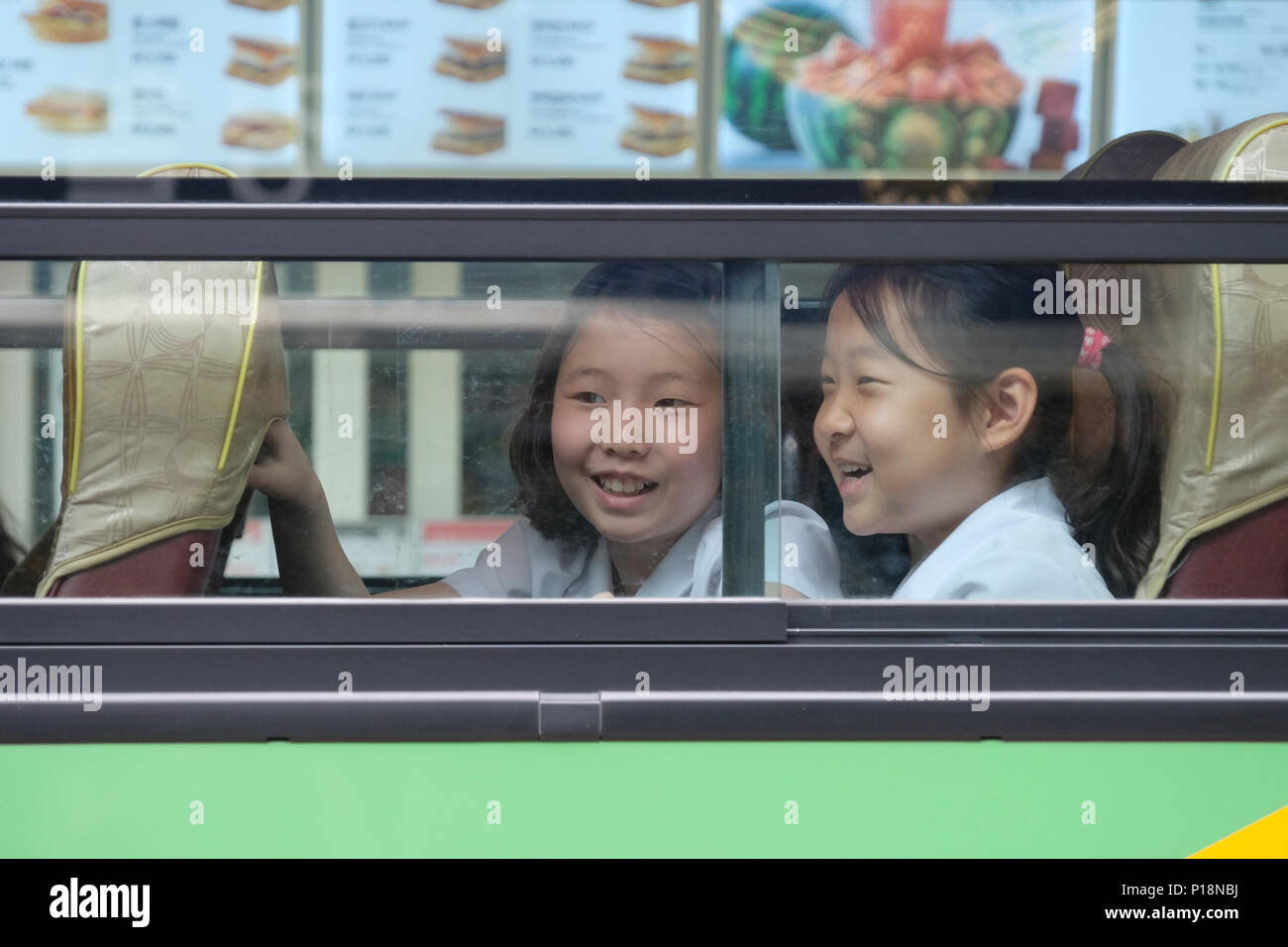 Young schoolchildren riding a bus in the city of Seoul capital of South ...
