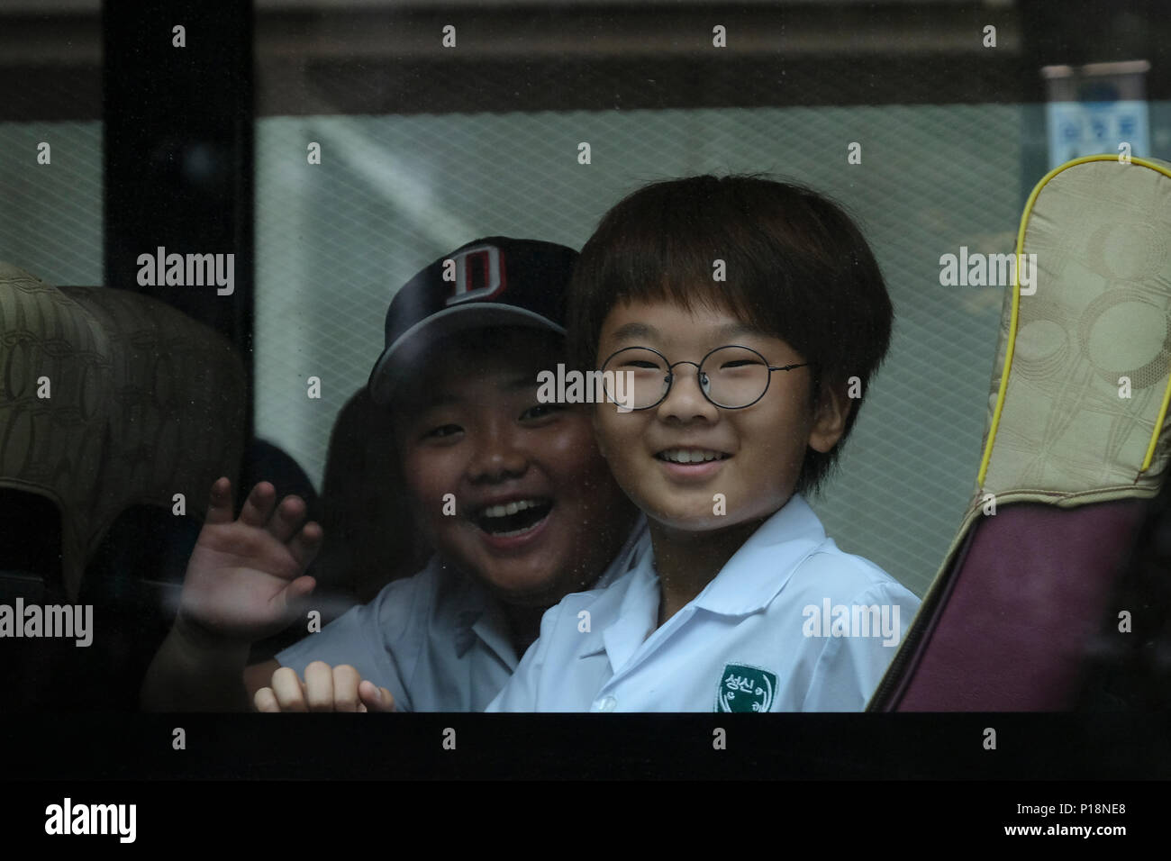Young schoolchildren riding a bus in the city of Seoul capital of South ...