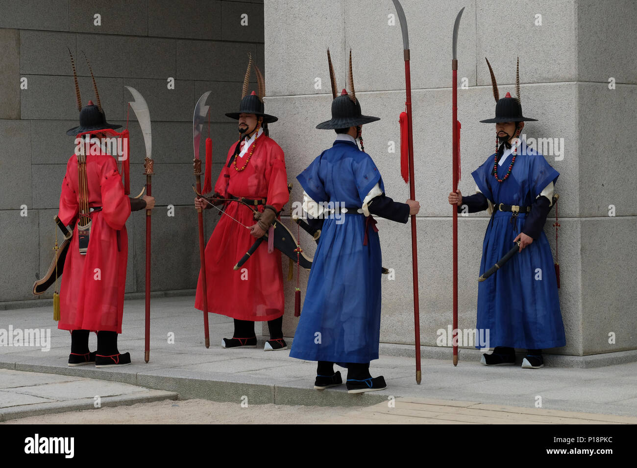 Men in traditional attire perform the Royal Guard Changing Ceremony ...