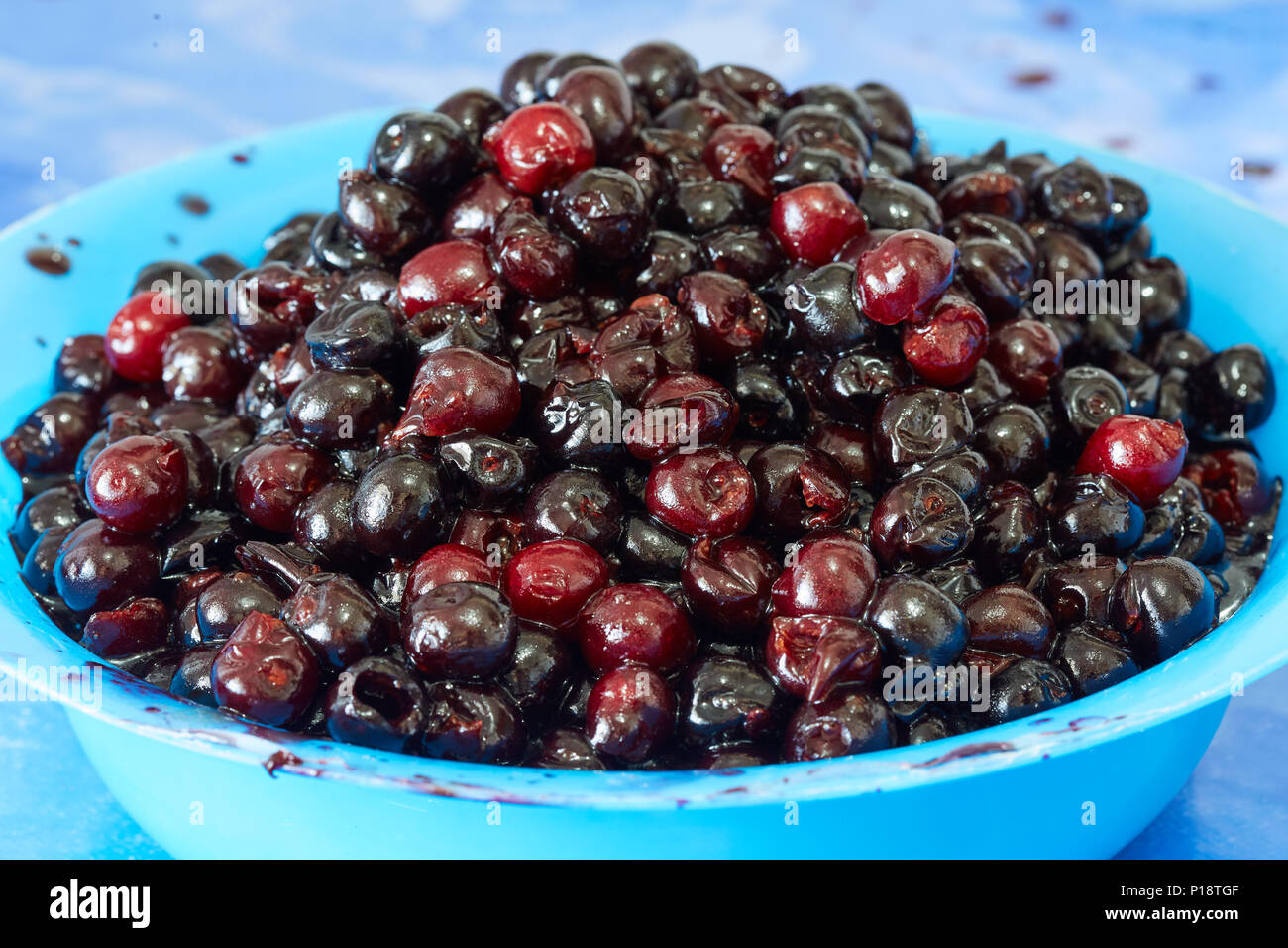 Pitted black bitter wild cherries ready to be turned into jam or ...