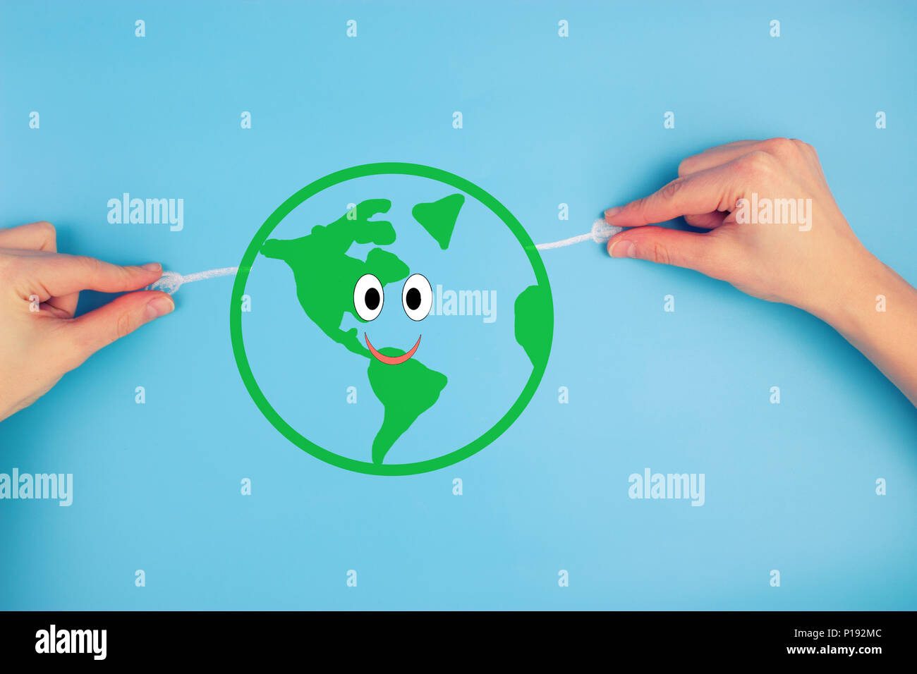 Save world save life concept. earth character holding hands with real ...