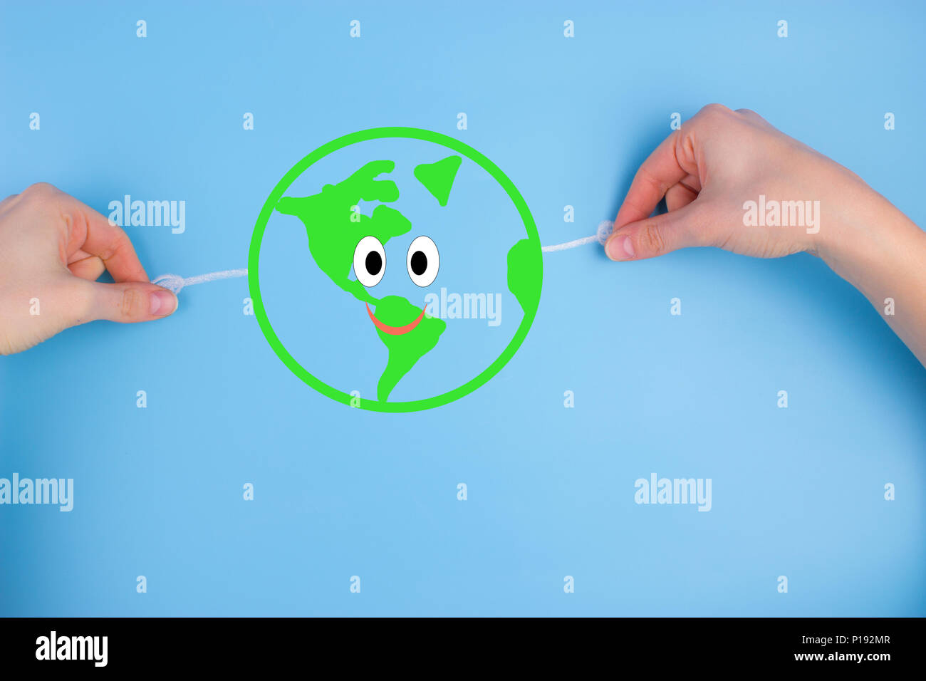 Save world save life concept. earth character holding hands with real ...