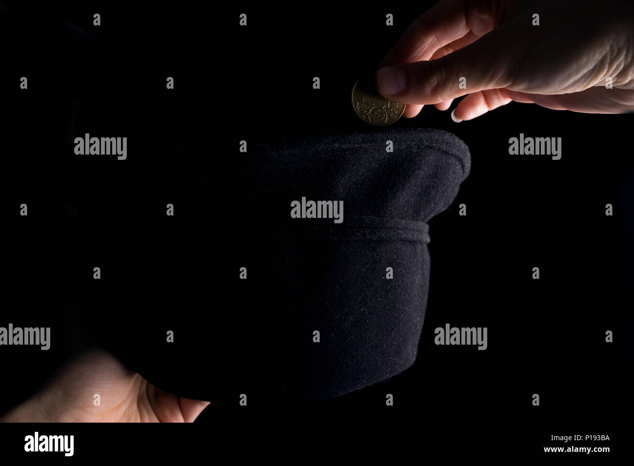 beg for money concept. beggar on black background Stock Photo - Alamy