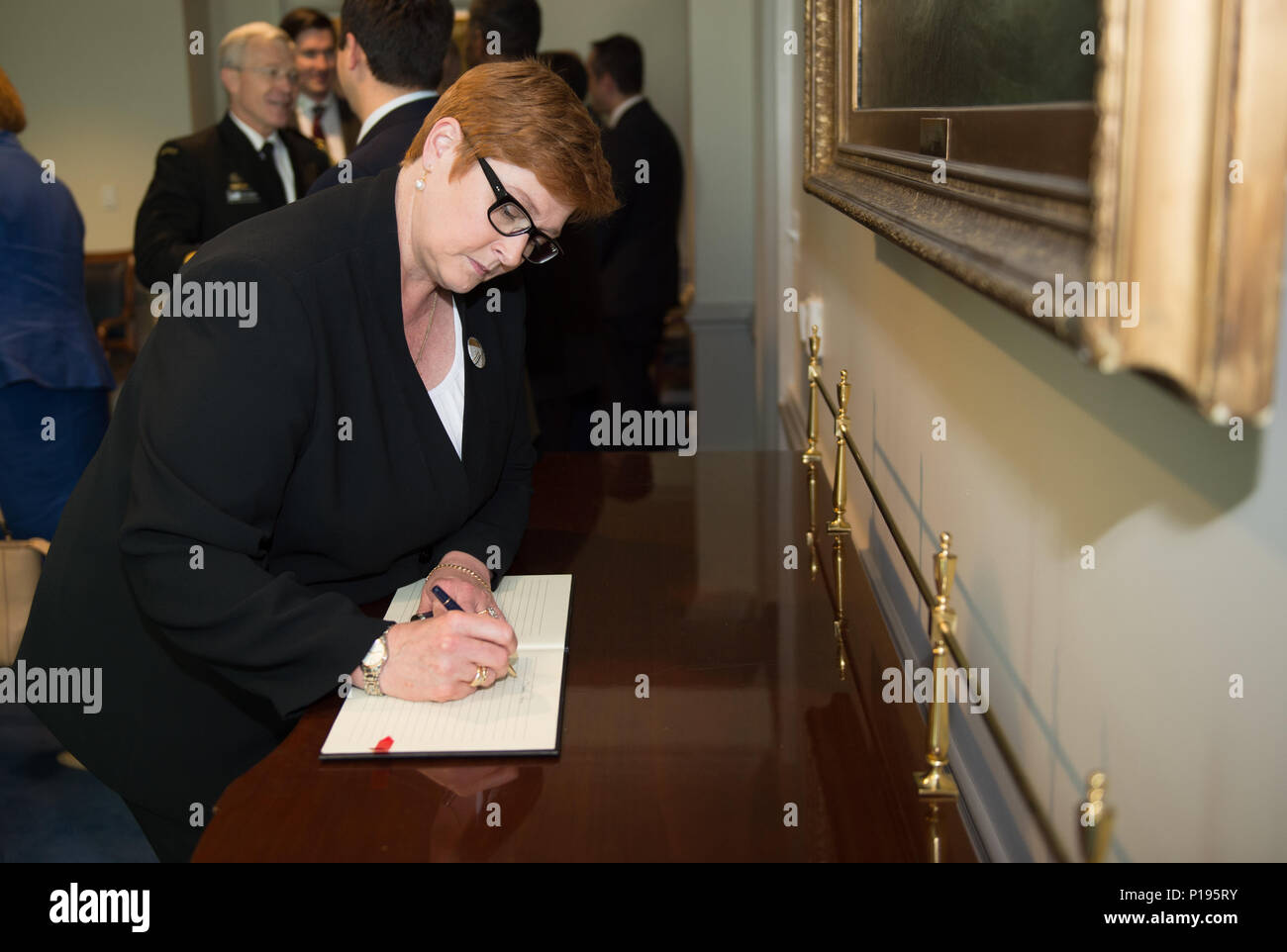 Australian Defence Minister Marise Payne signs the guest book following ...