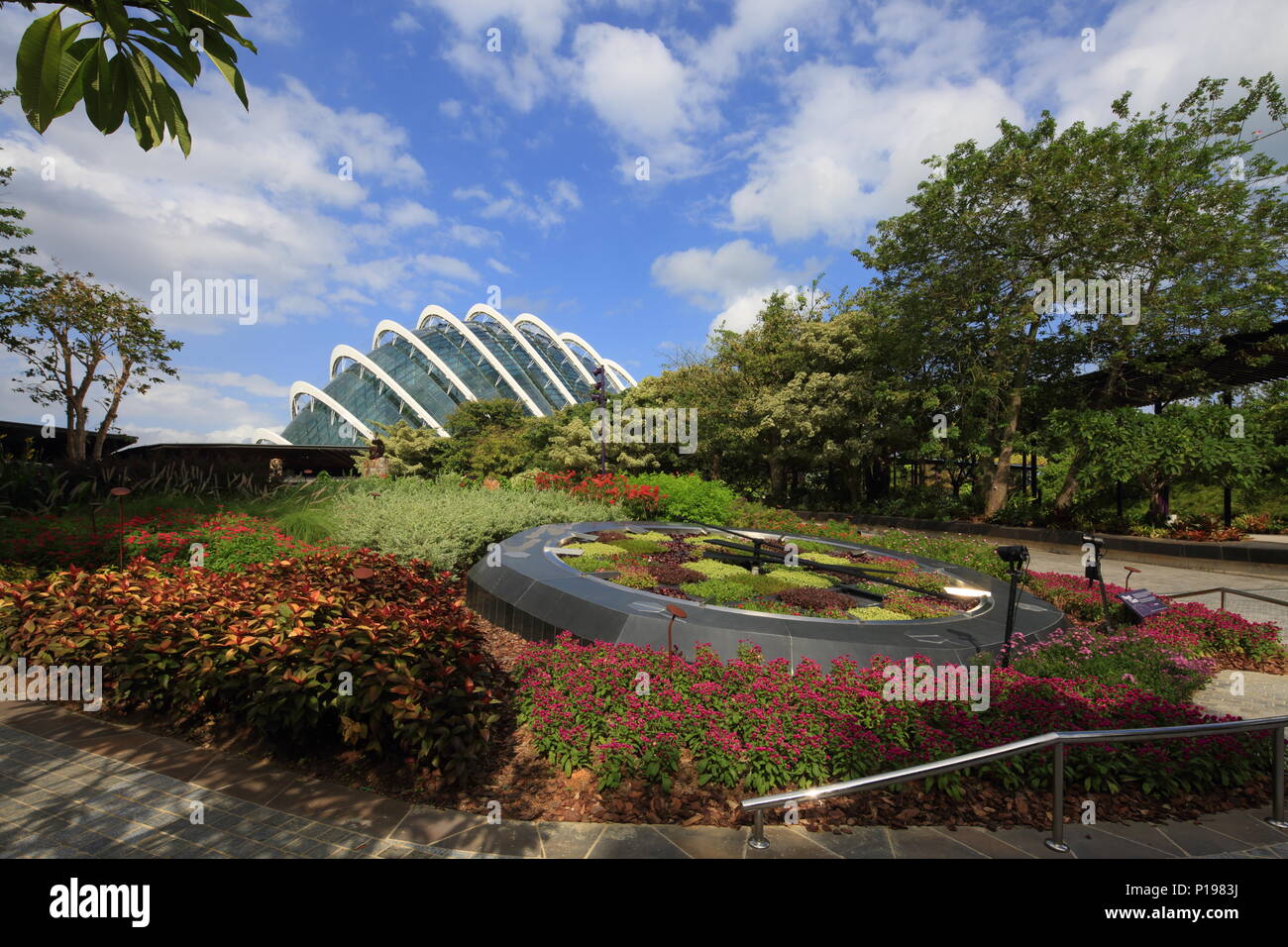 Outdoor landscaping of a lay giant clock with various type of plants at ...