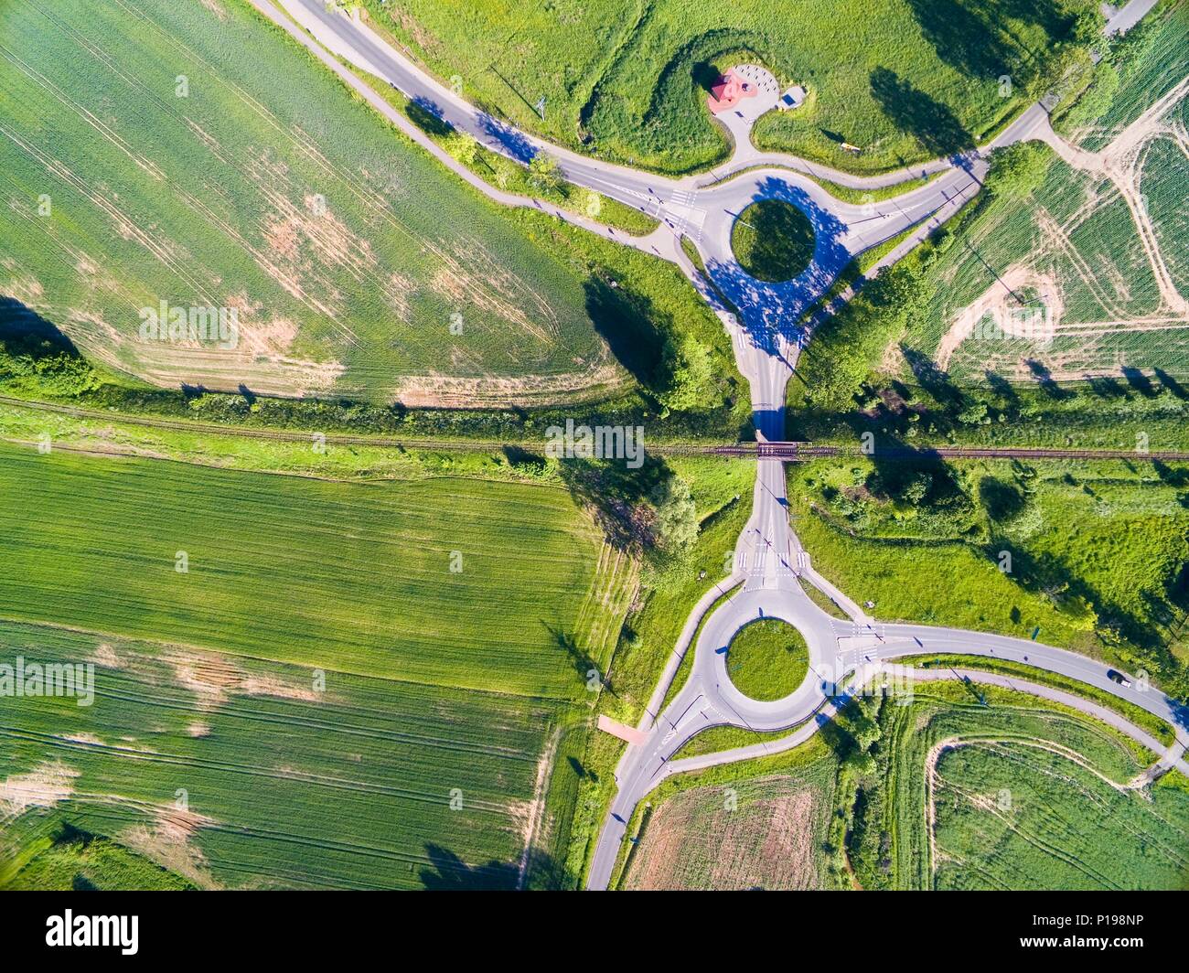 Aerial view of roundabout circles, railroad line and bike lanes, Mazury ...
