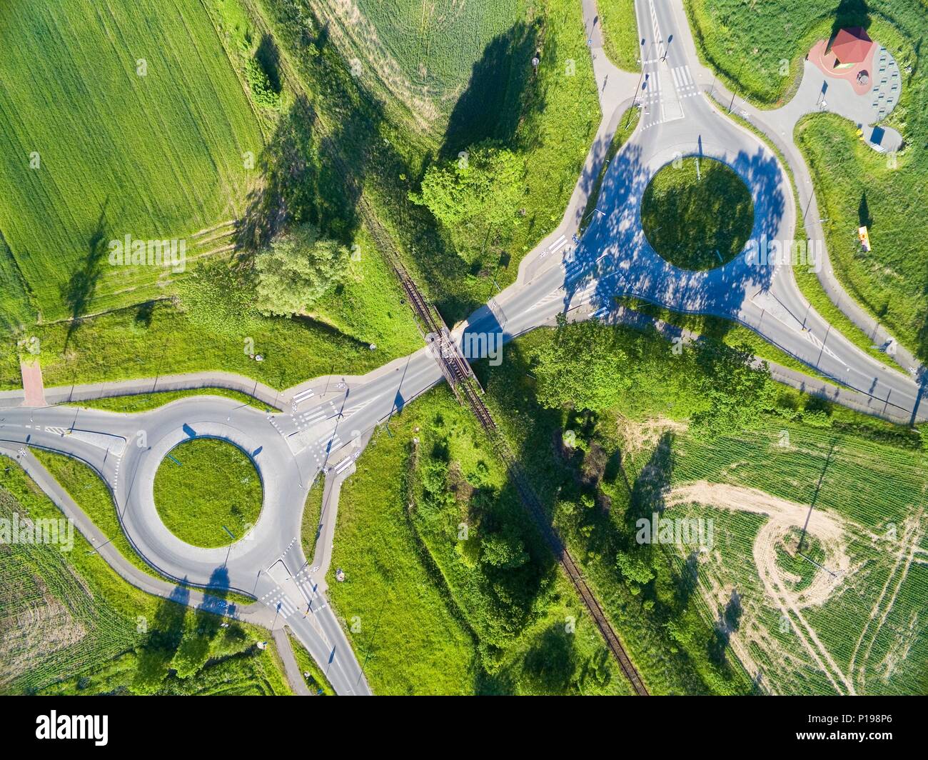 Aerial view of roundabout circles, railroad line and bike lanes, Mazury ...