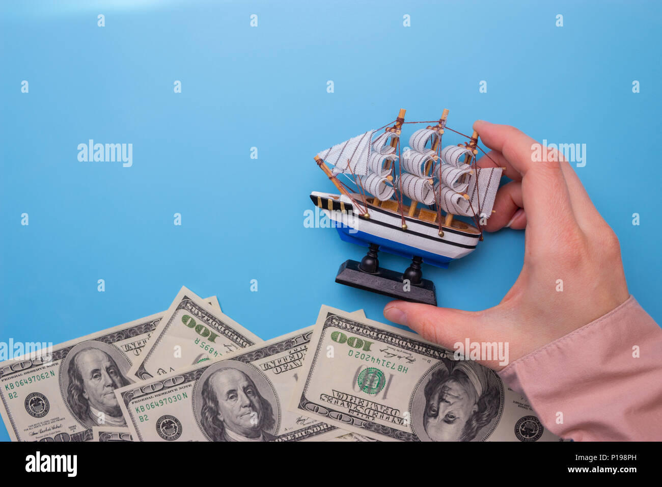 ship floating on waves, made from dollar bills Stock Photo - Alamy