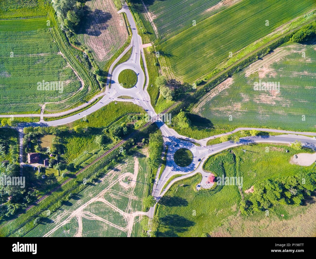 Aerial view of roundabout circles, railroad line and bike lanes, Mazury ...