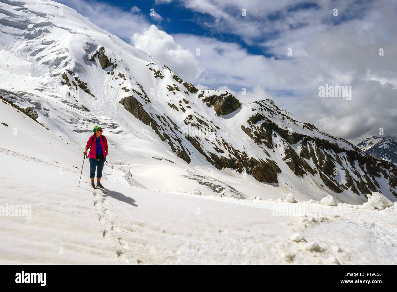 Female hiker on snow, Weissmies mountain Saas Grund, Saastal ...