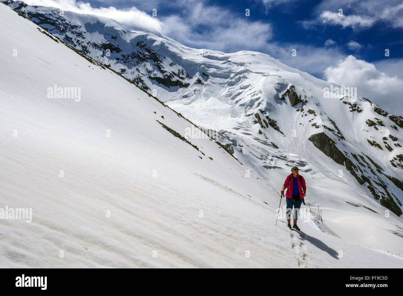 Female hiker on snow, Weissmies mountain Saas Grund, Saastal ...