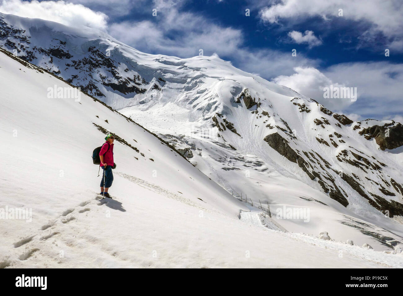 Female hiker on snow, Weissmies mountain Saas Grund, Saastal ...