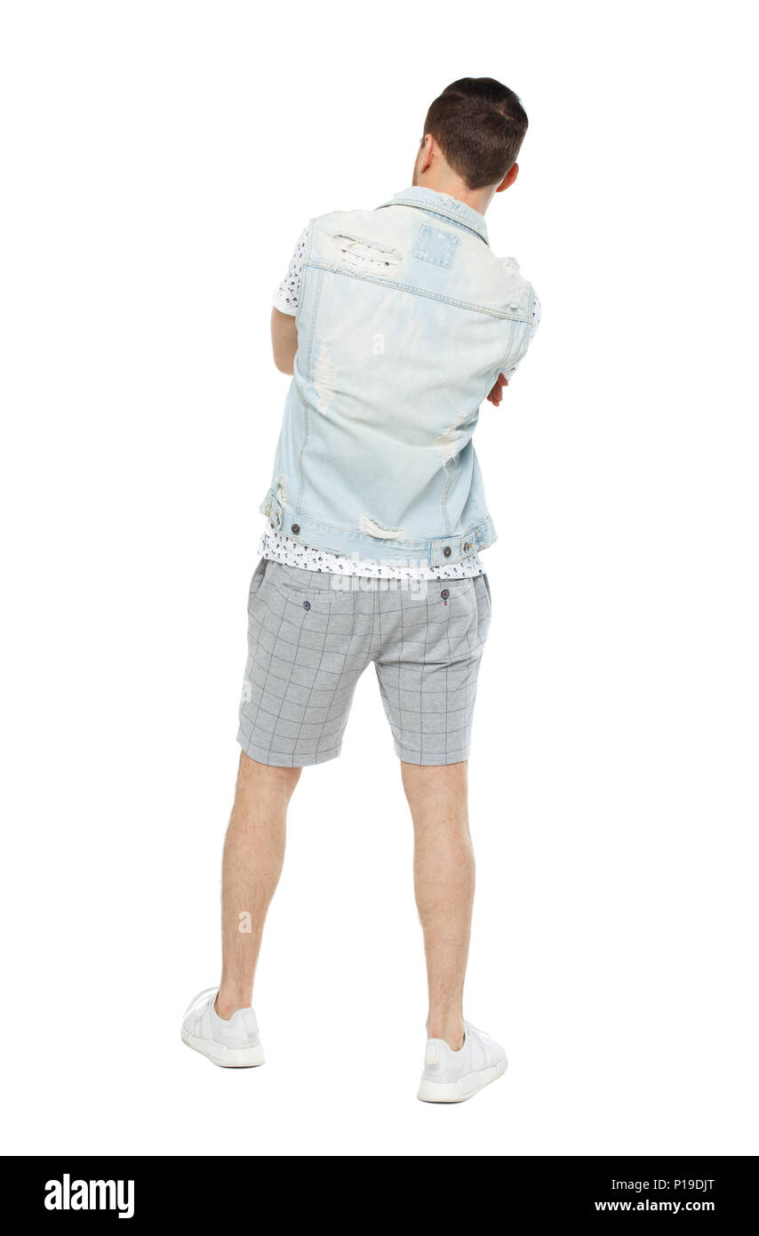Back view of a stylish man iin shorts. Rear view people collection ...