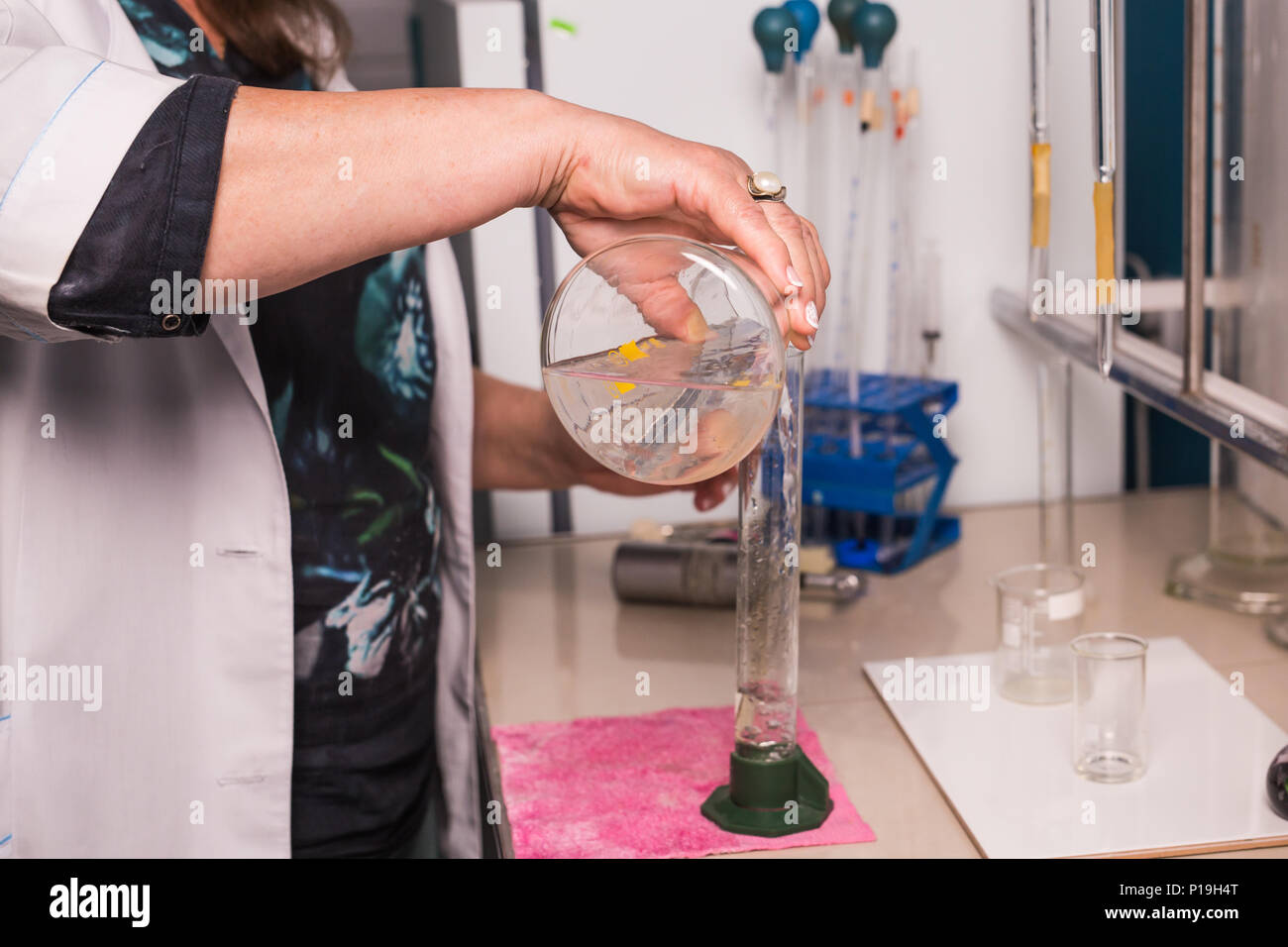 Lab assistant testing water quality close up Stock Photo - Alamy