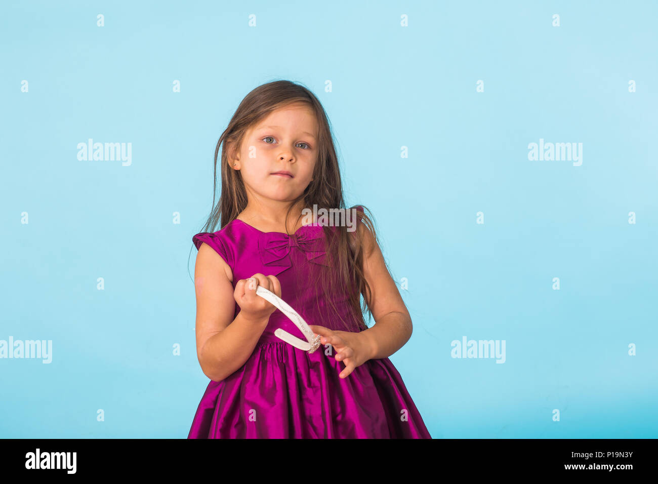 cute cheerful little girl portrait, isolated on blue background Stock ...