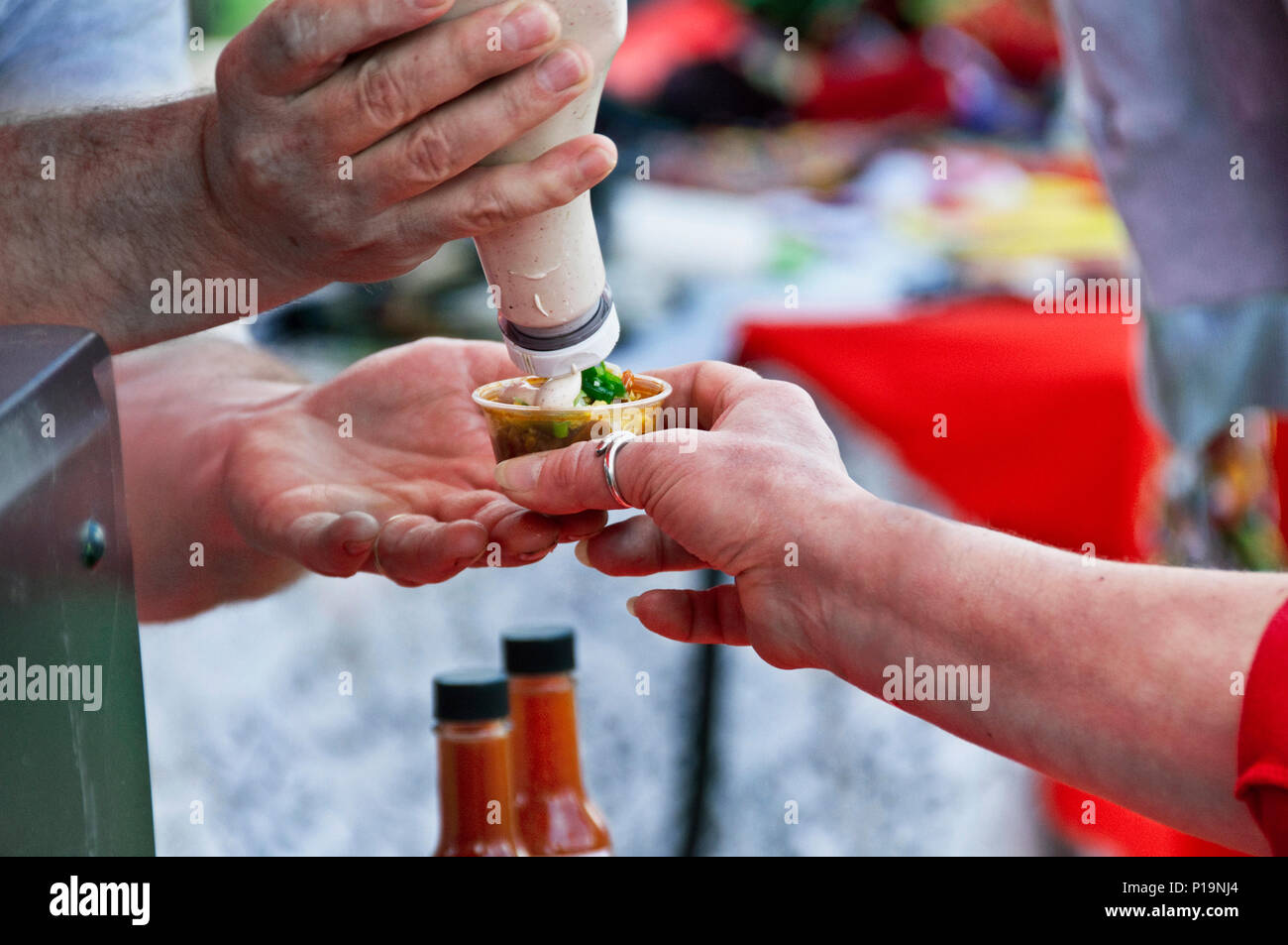 Chili Cooking Tasting: Sample Offered with Garnish Stock Photo - Alamy