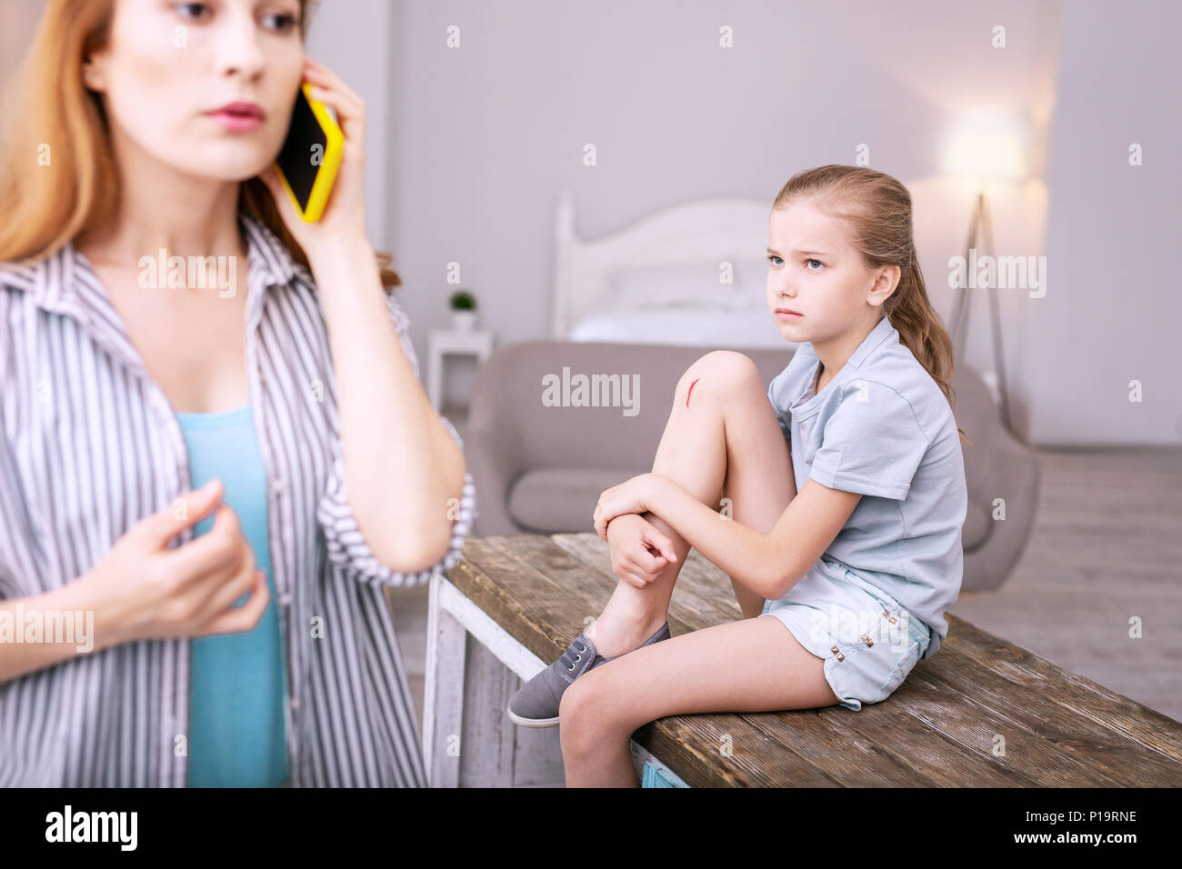 Sad cheerless girl having a scratch Stock Photo - Alamy