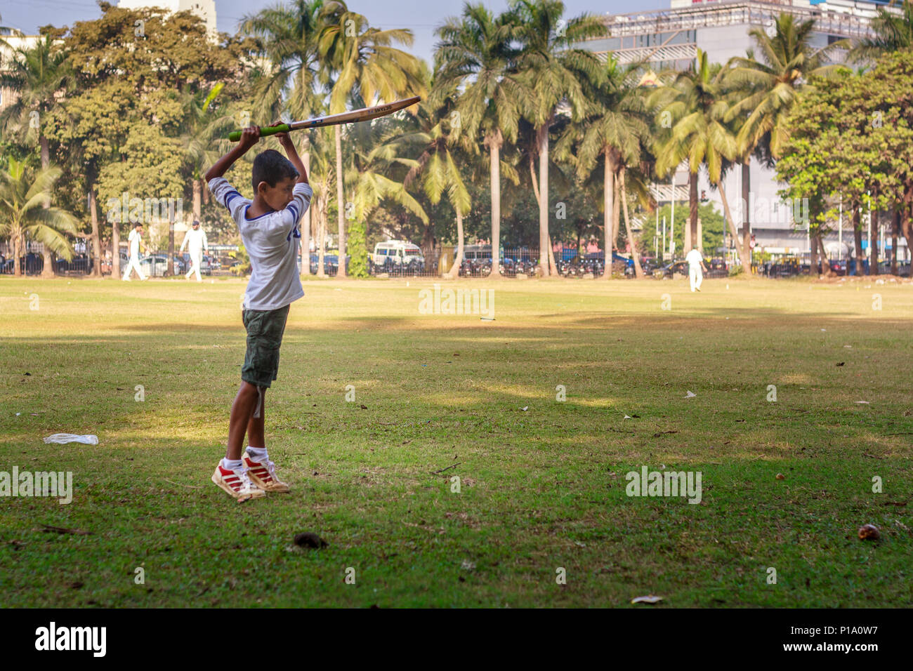 MUMBAI, INDIA - DECEMBER 4, 2016 : A kid practicing batting skills at ...