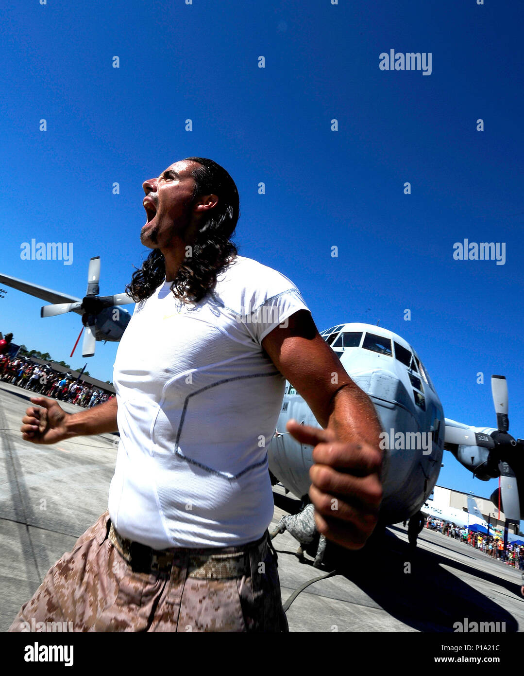 Strong man Mark Kirsch celebrates after pulling a U.S. Air Force HC-130 ...