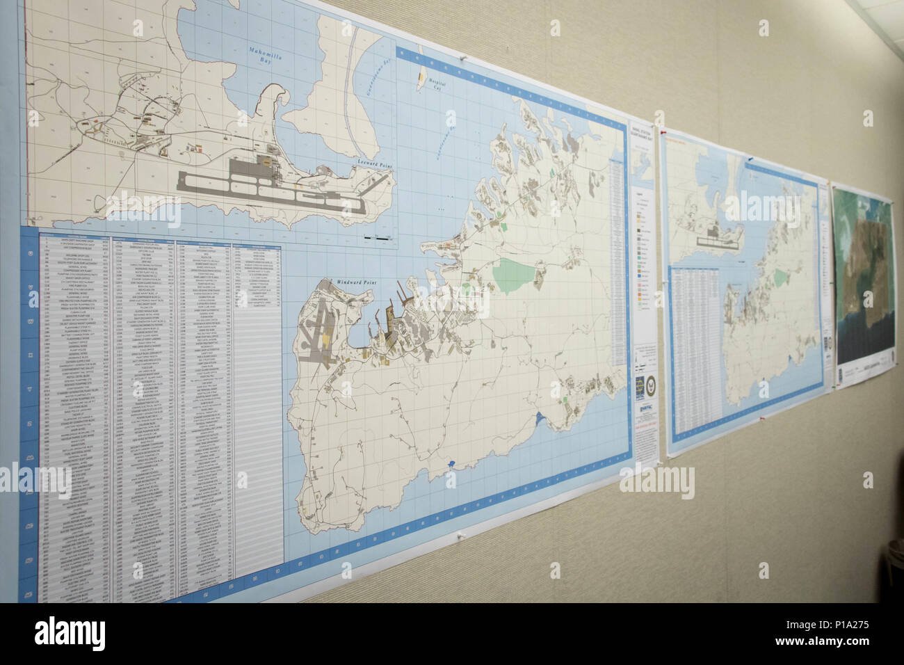 Maps of Naval Station Guantanamo Bay, Cuba, line the walls of the ...
