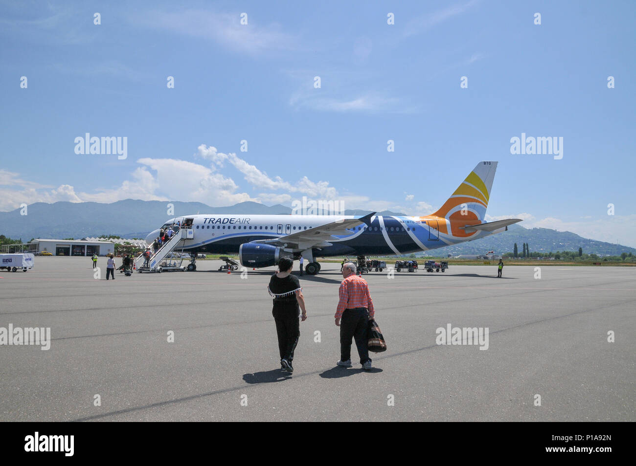 Passengers boarding a Trade Air Airbus A320-200 at Batumi international ...