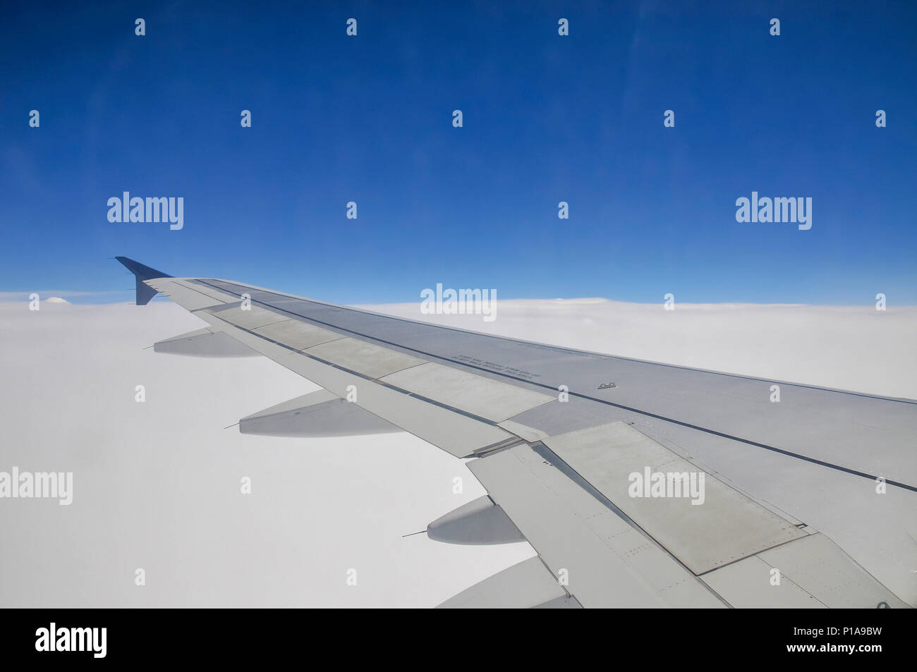 elevated view of clouds as seen through the window of an Airbus A320 ...