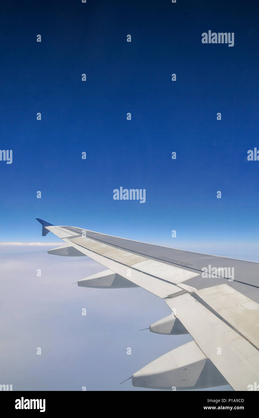 elevated view of clouds as seen through the window of an Airbus A320 ...
