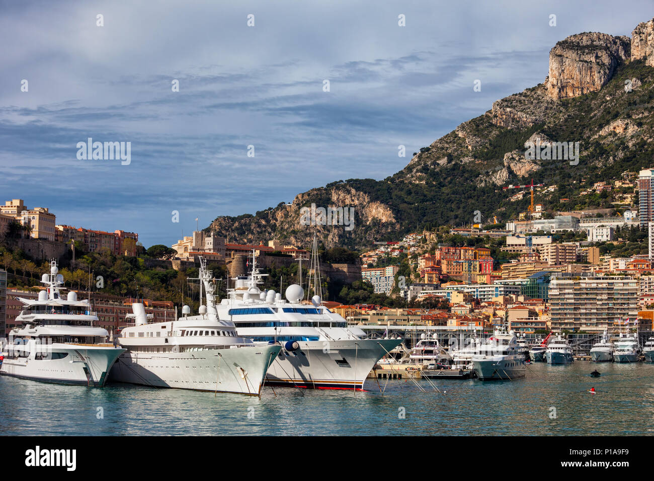Principality of Monaco, Port of Hercules with luxury yachts and city ...