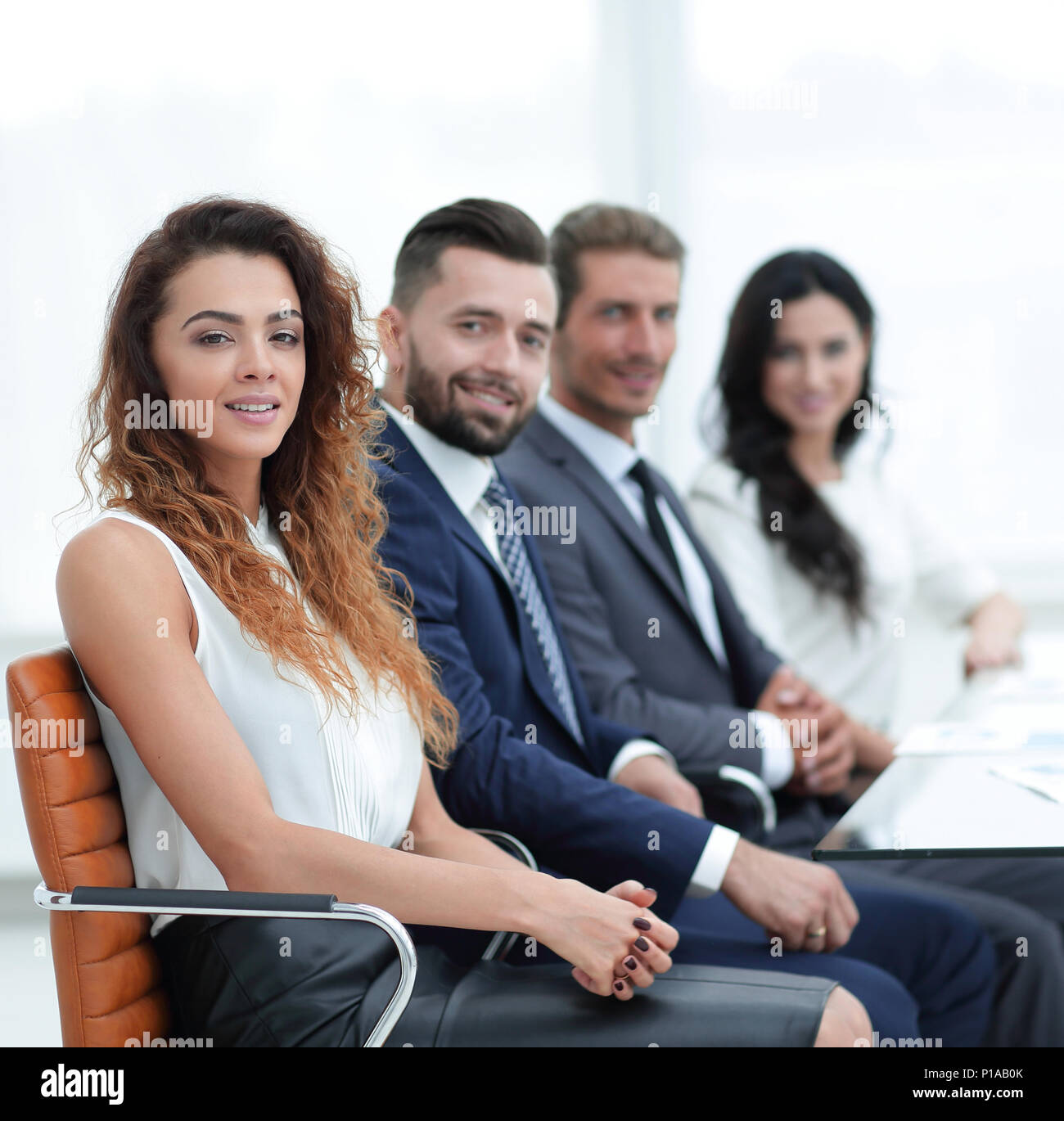 closeup.business team sitting in the conference room Stock Photo - Alamy