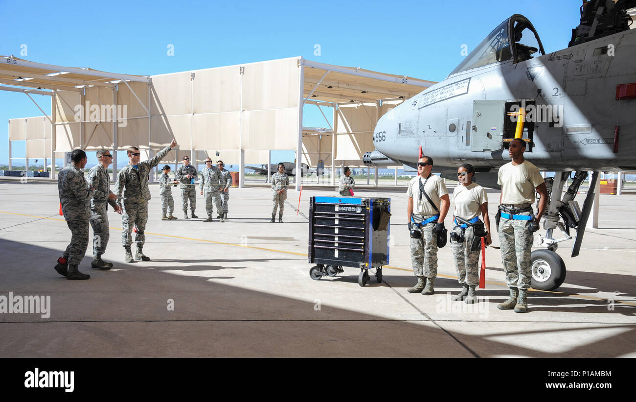 U.S. Airmen assigned to the 354th Aircraft Maintenance Unit stand at ...