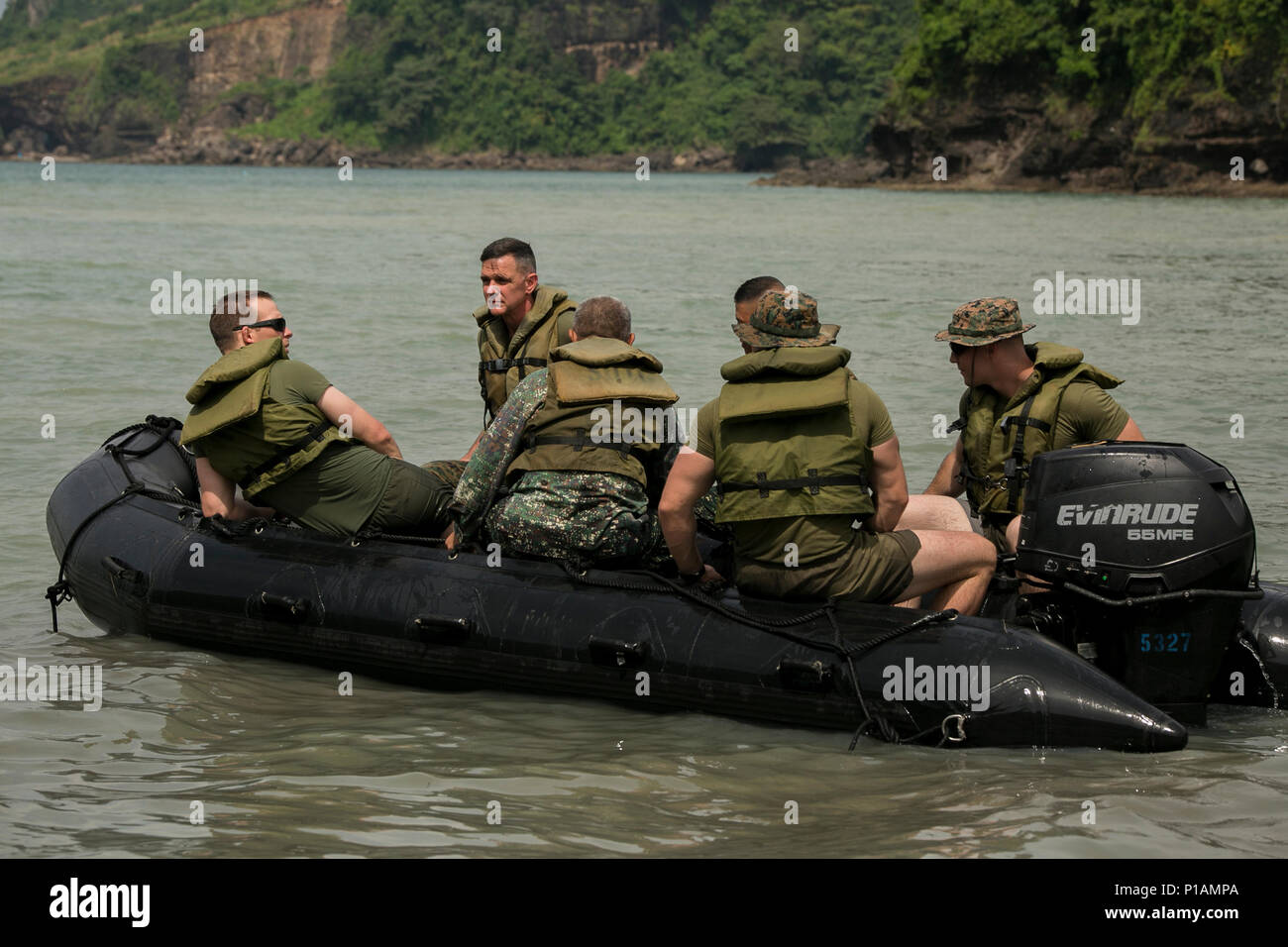 U.S. Marine Brig. Gen. John Jansen rides in a combat rubber raiding ...