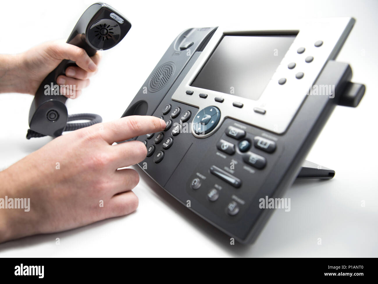 Making a call, man is dialing IP telephone keypad Stock Photo - Alamy