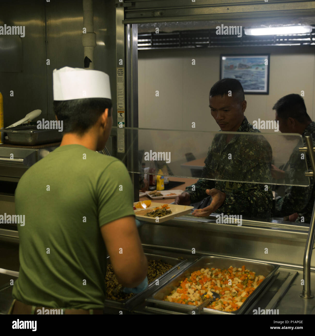 U.S. Marine Lance Cpl. Kevin Tran, from Shakopee, Minn., serves ...