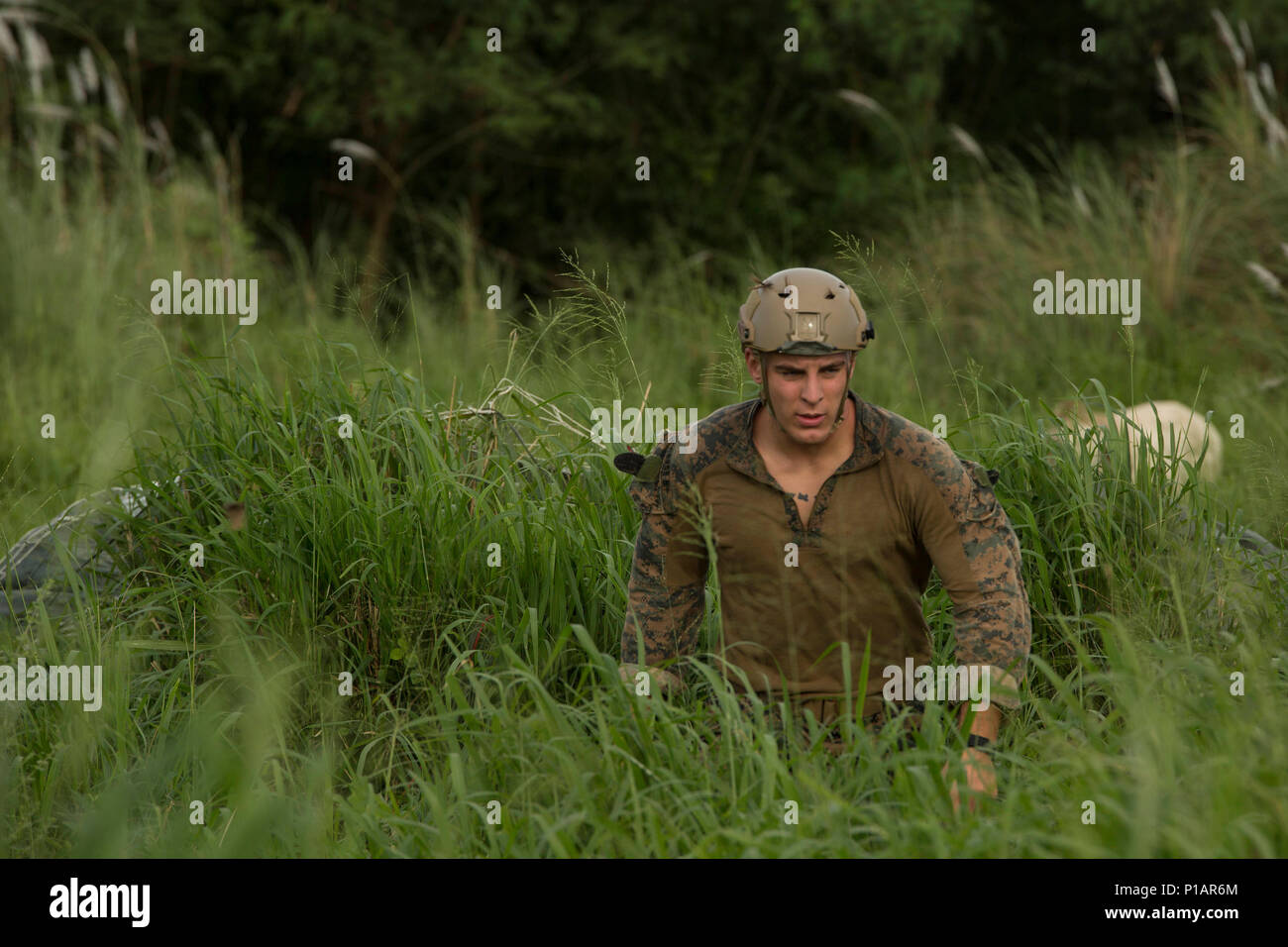 U.S. Marine Cpl. Jacob Carpenter, from Estes Park, Colo., retrieves his ...