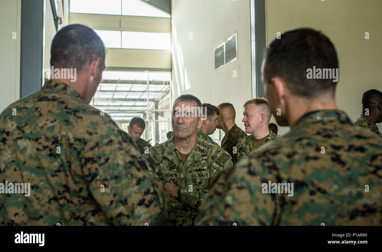 U.S. Navy Rear Adm. Roy Kitchener, center, commander of Expeditionary ...